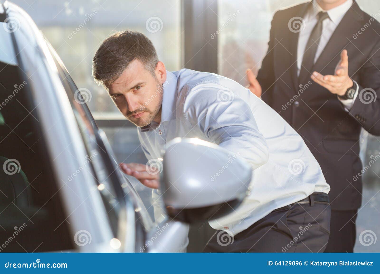 Checking Everything before Buying Stock Photo - Image of young, working ...
