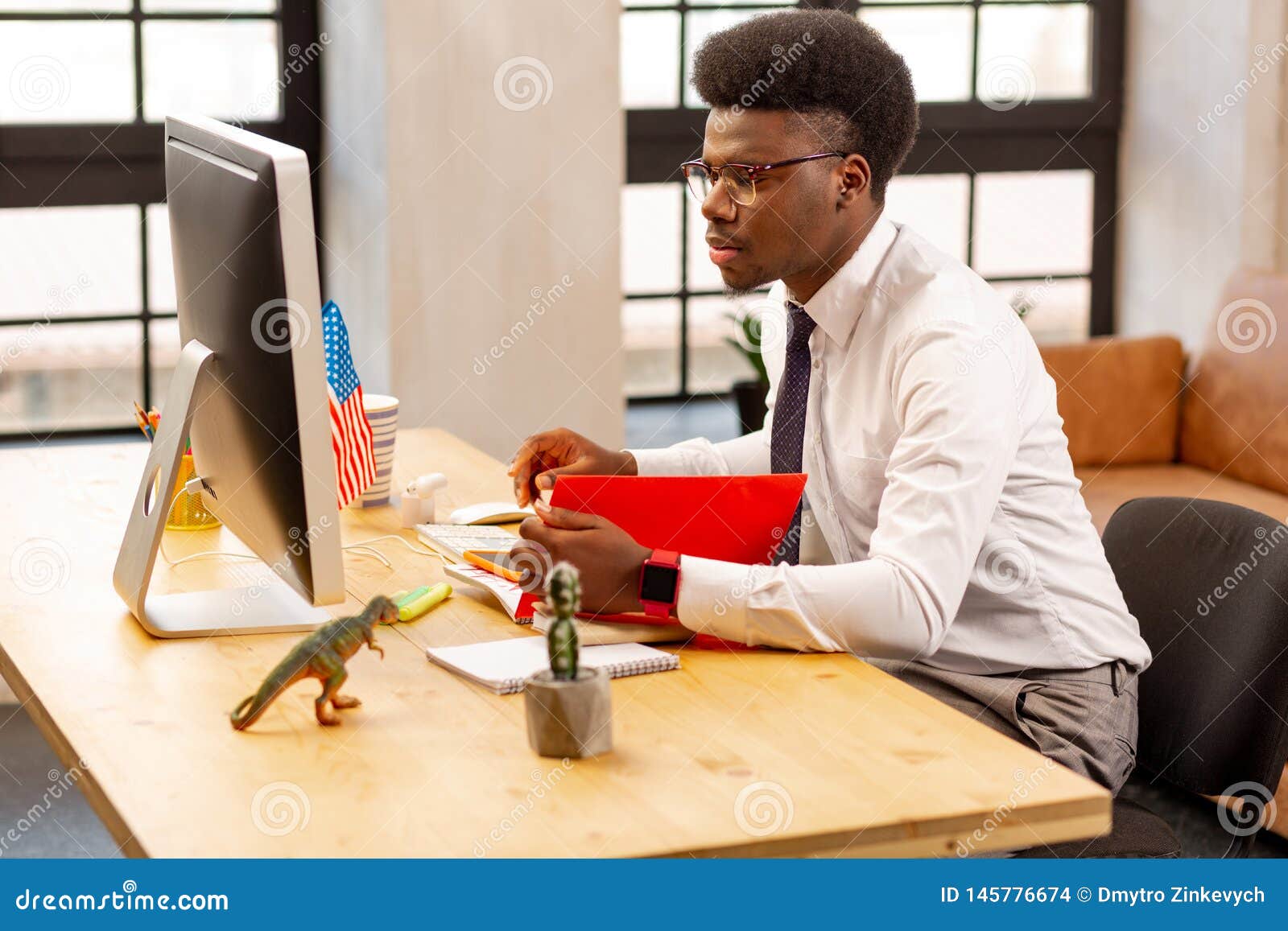 Handsome Young Man Doing His Work Carefully Stock Photo - Image of ...