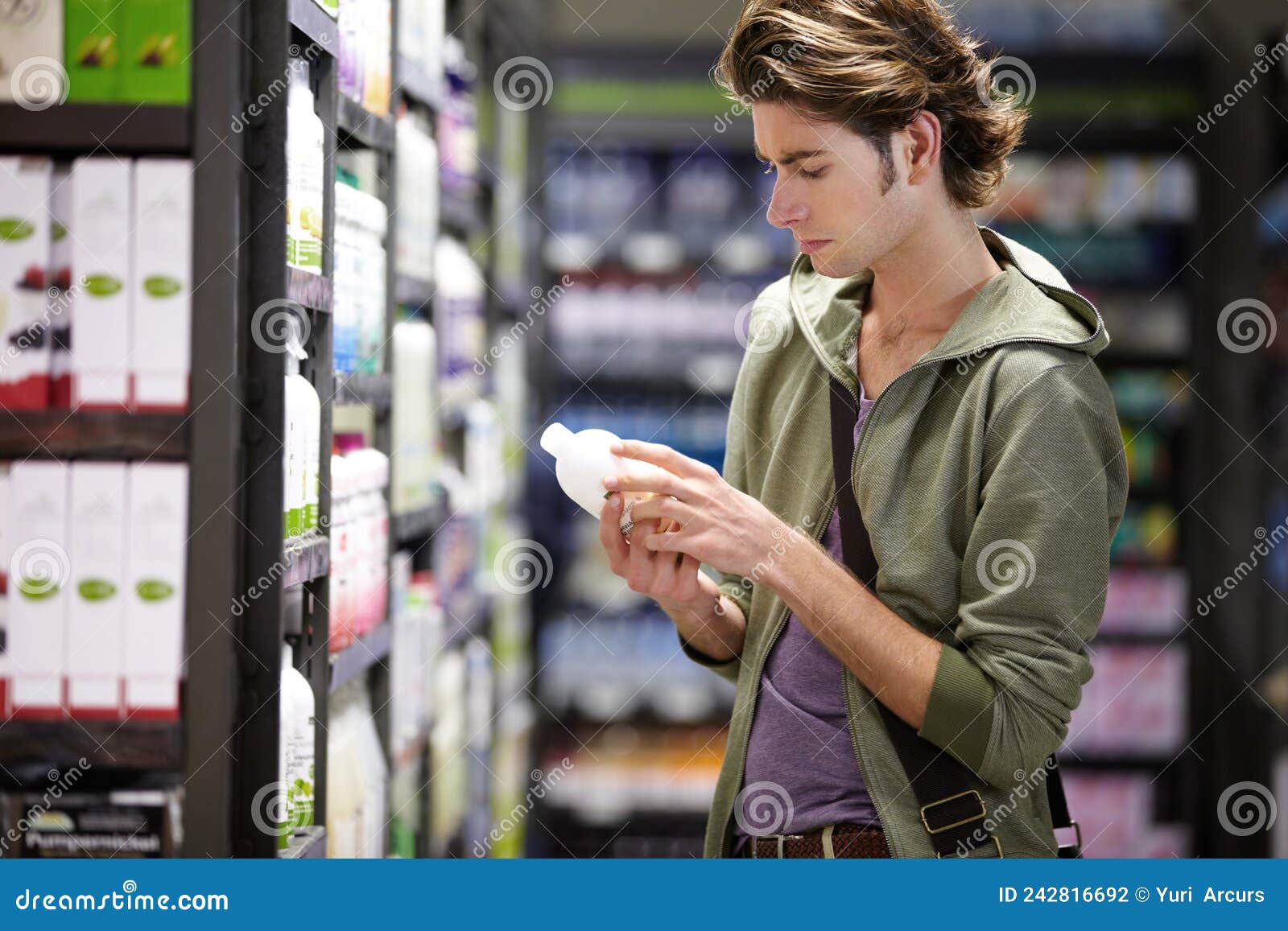 Checking the Expiry Date. a Young Man Looking at the Expiry Date on a ...