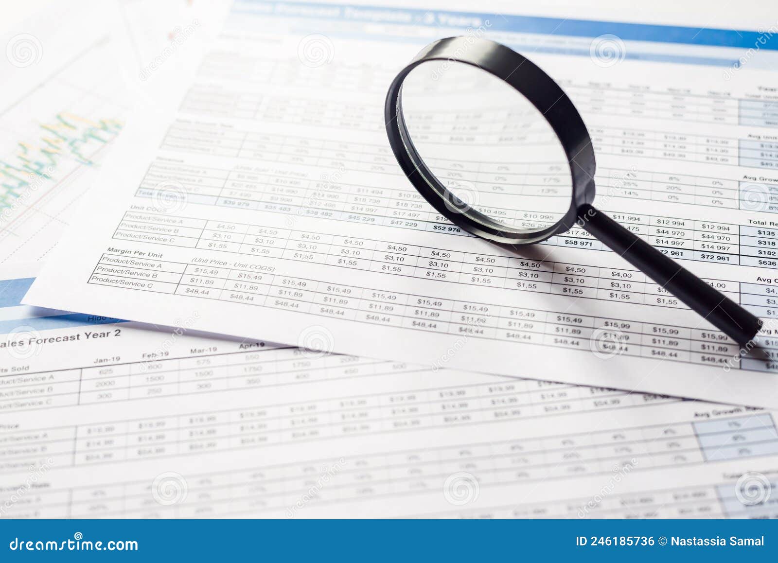 Checking Financial Reports. Documents and Magnifying Glass Stock Photo ...