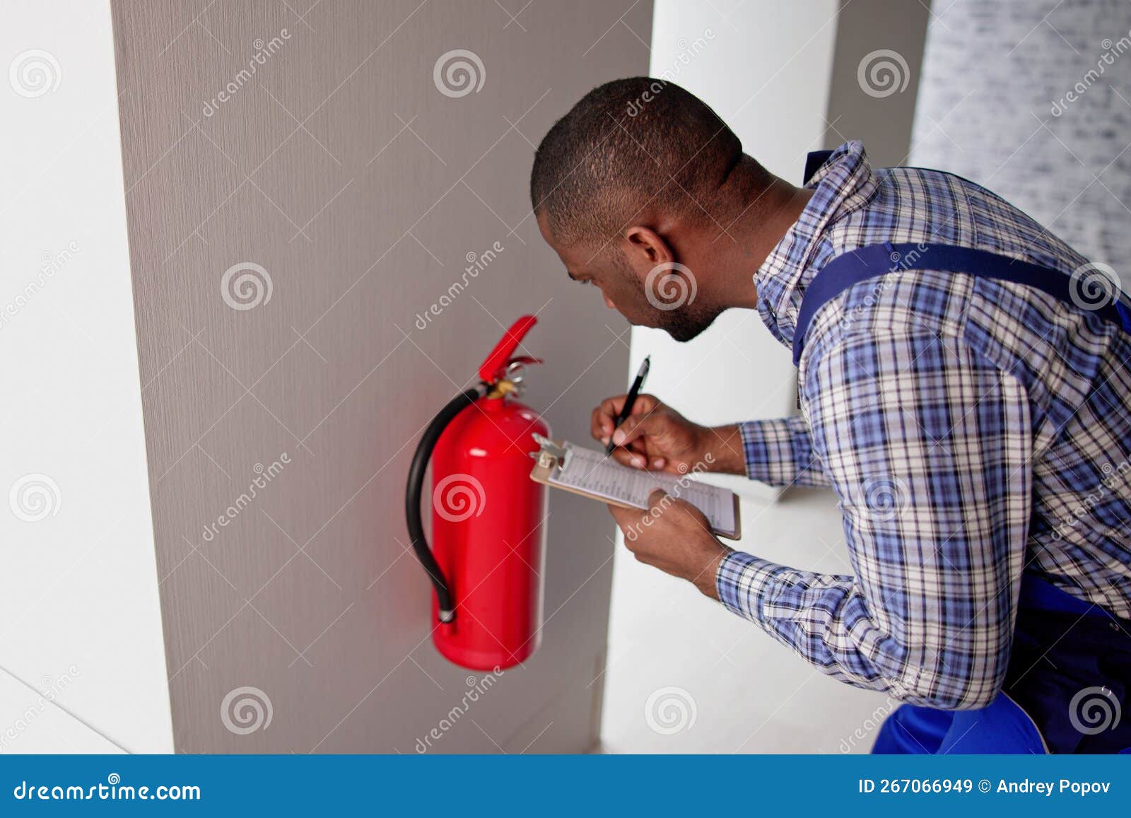 Checking Fire Extinguisher stock image. Image of extinguisher - 267066949