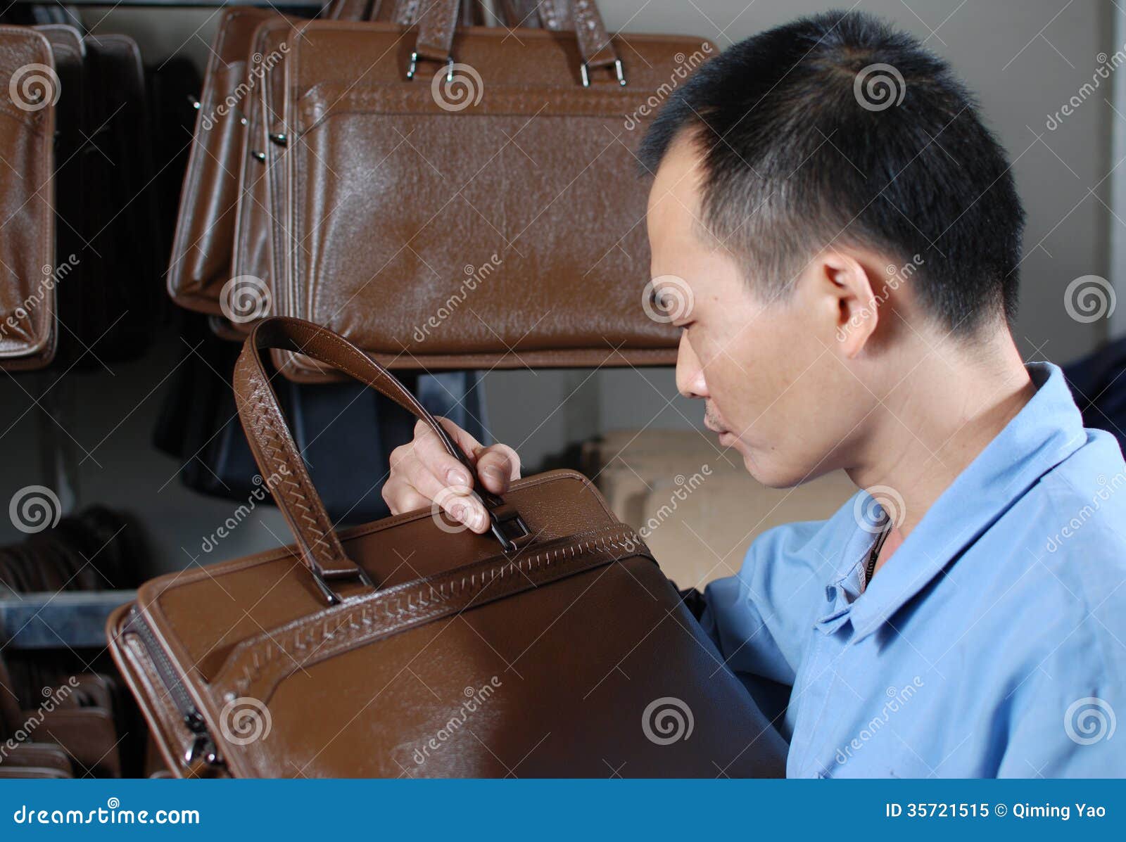 Checking the handbag stock image. Image of conscientious - 35721515