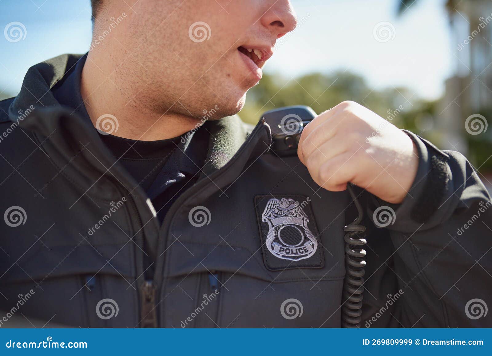 Checking in with Headquarters. an Unrecognizable Policeman Radioing in ...