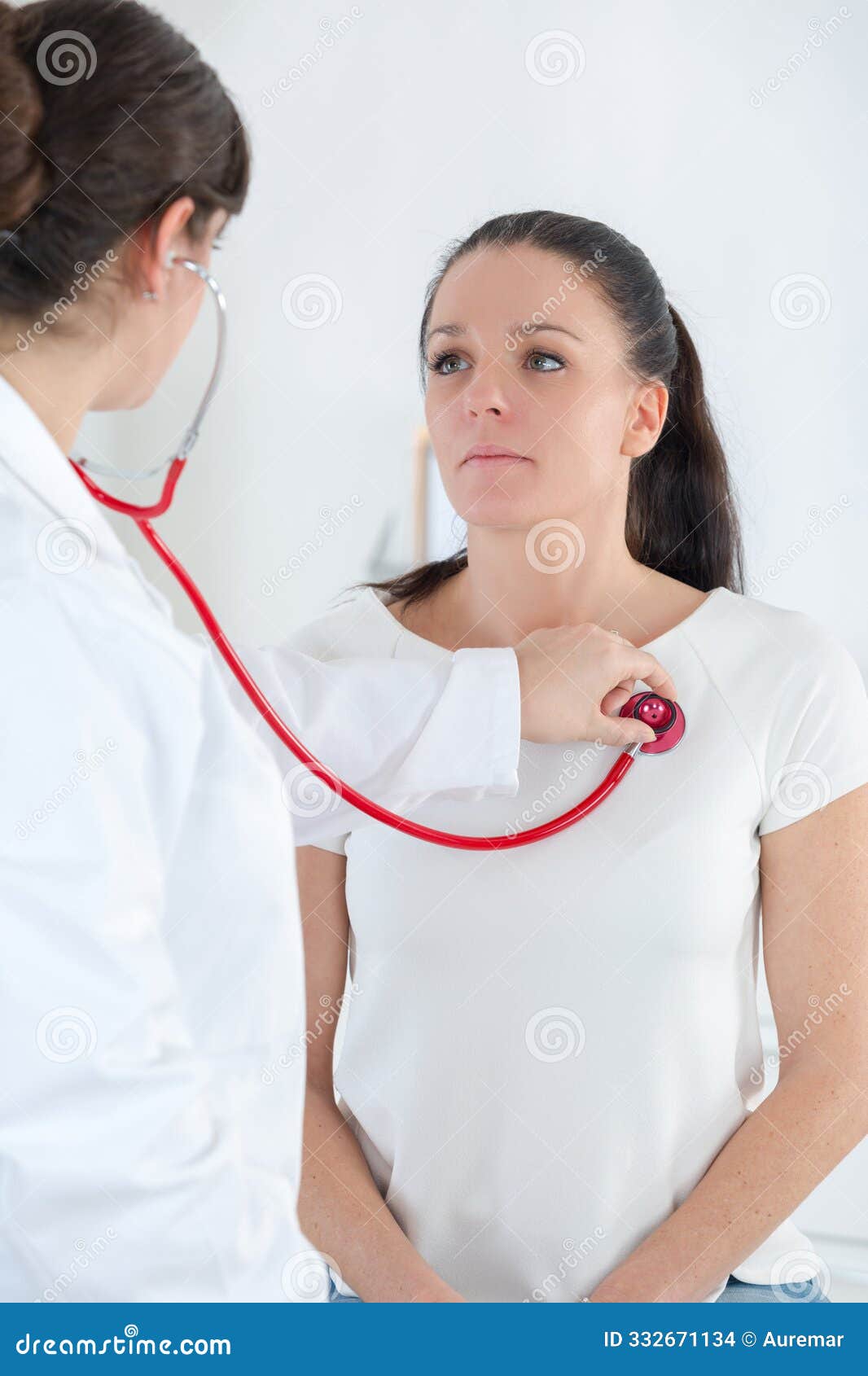 She checking heart stock photo. Image of examine, nurse - 332671134