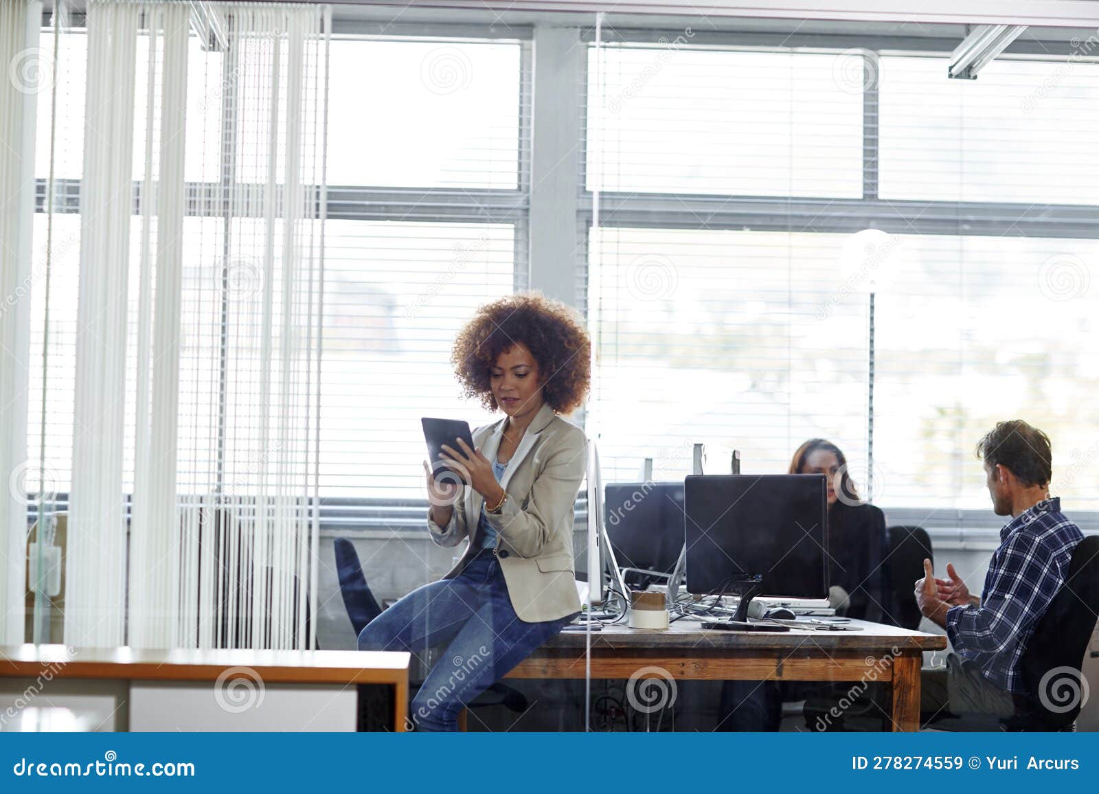 Checking Her Emails. a Beautiful Young Businesswoman Using Her Tablet ...