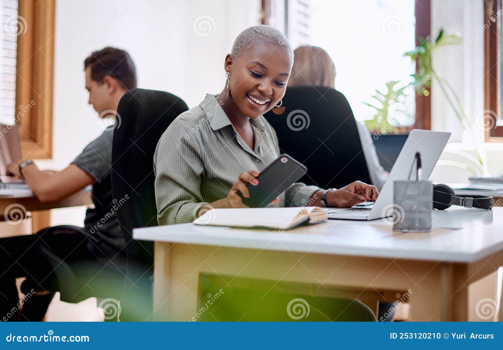 Checking Her Notifications. a Young Businesswoman Using a Cellphone ...