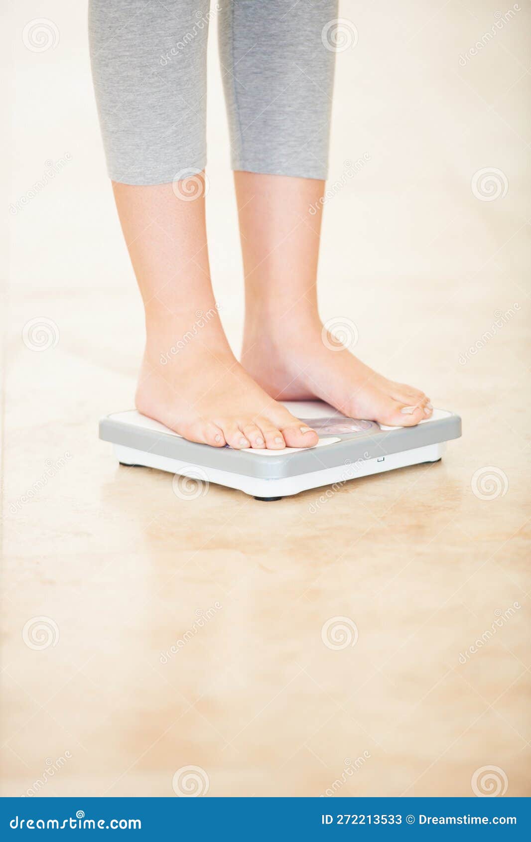 Checking Her Weight. Cropped Image of a Woman Standing on a Scale ...
