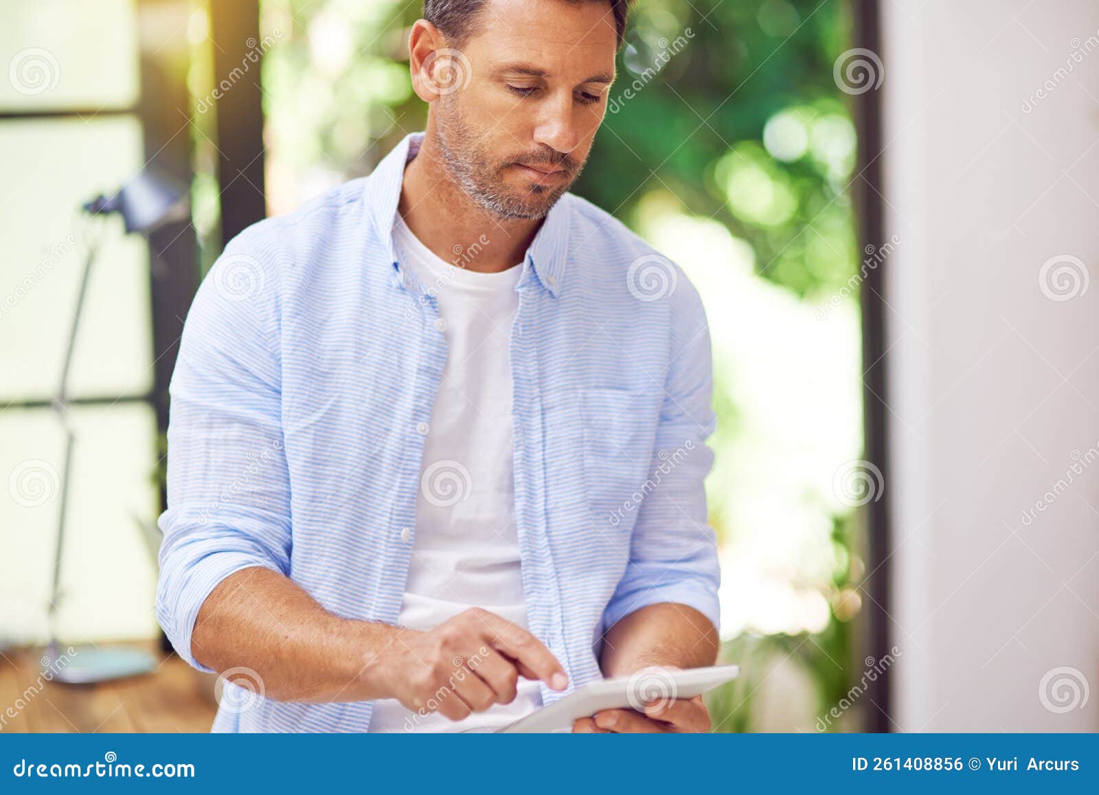 Checking His Emails on the Go. a Young Man Working from Home. Stock ...