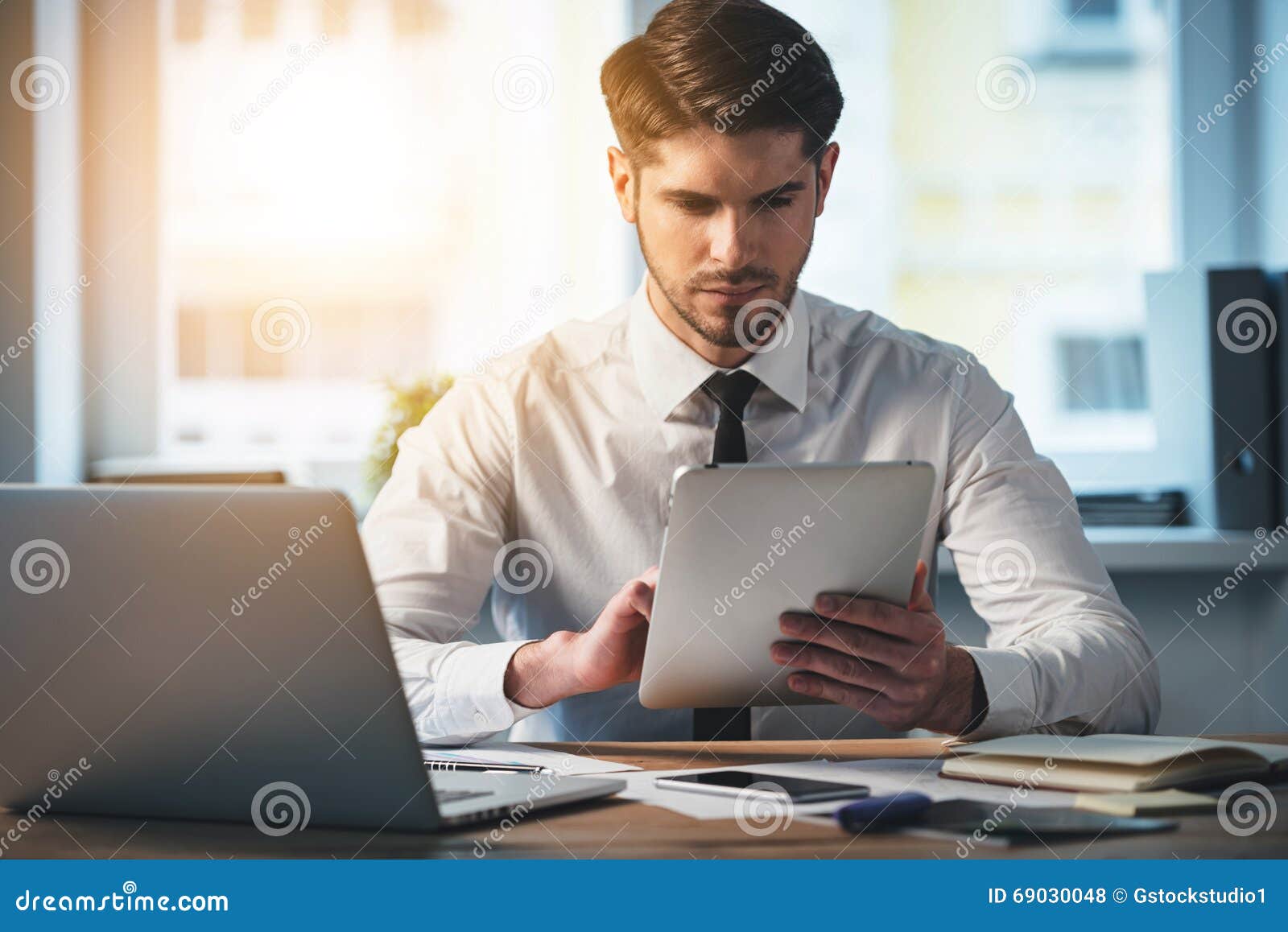 Checking his timetable. stock photo. Image of ideas, adult - 69030048
