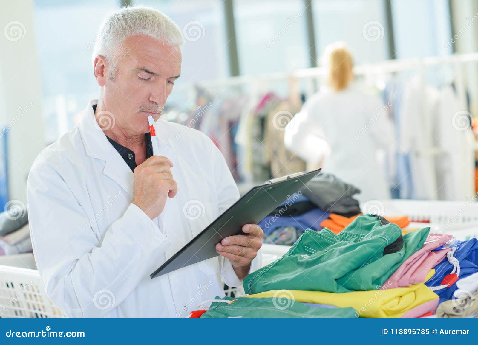 Checking the Laundry Record Stock Image - Image of clothing, name ...