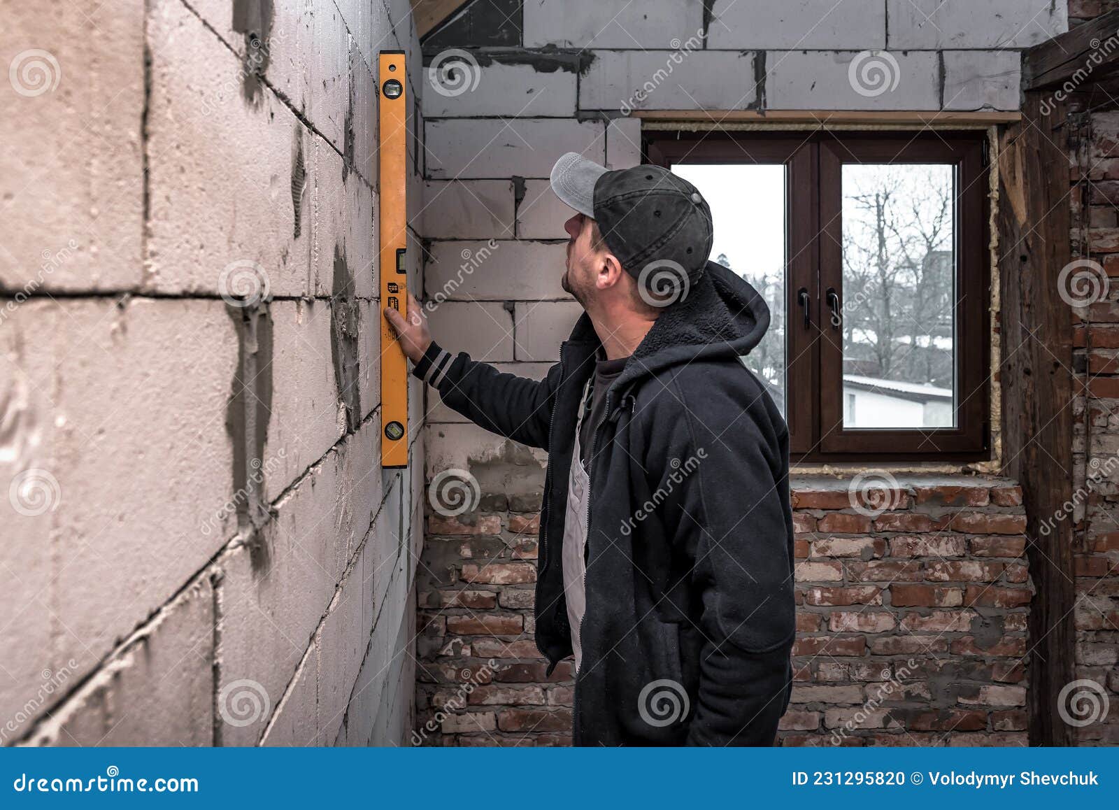 Checking Level of the Wall with the Water Level Tool Stock Photo ...