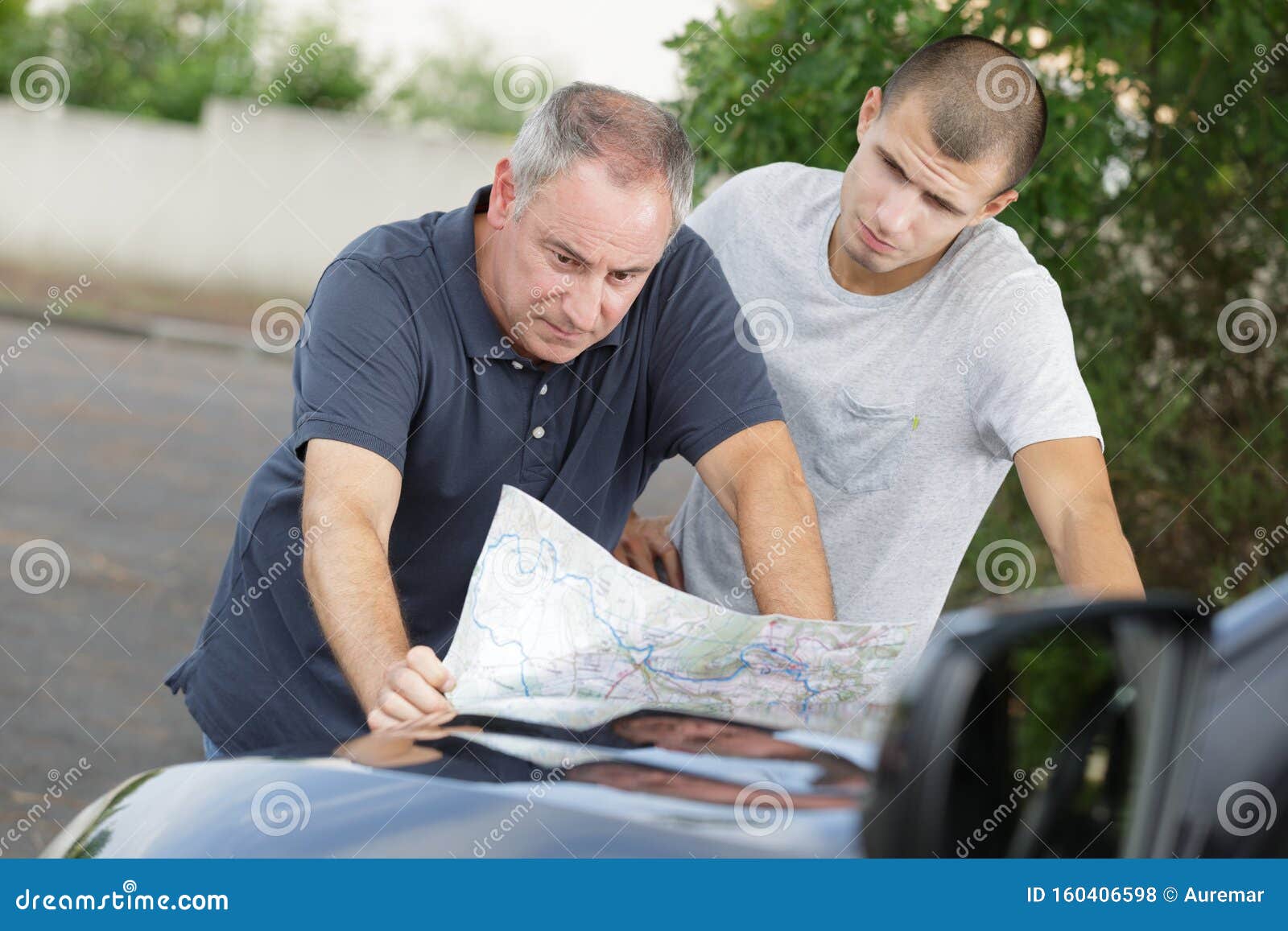 Checking map on car stock photo. Image of friendly, speaking - 160406598
