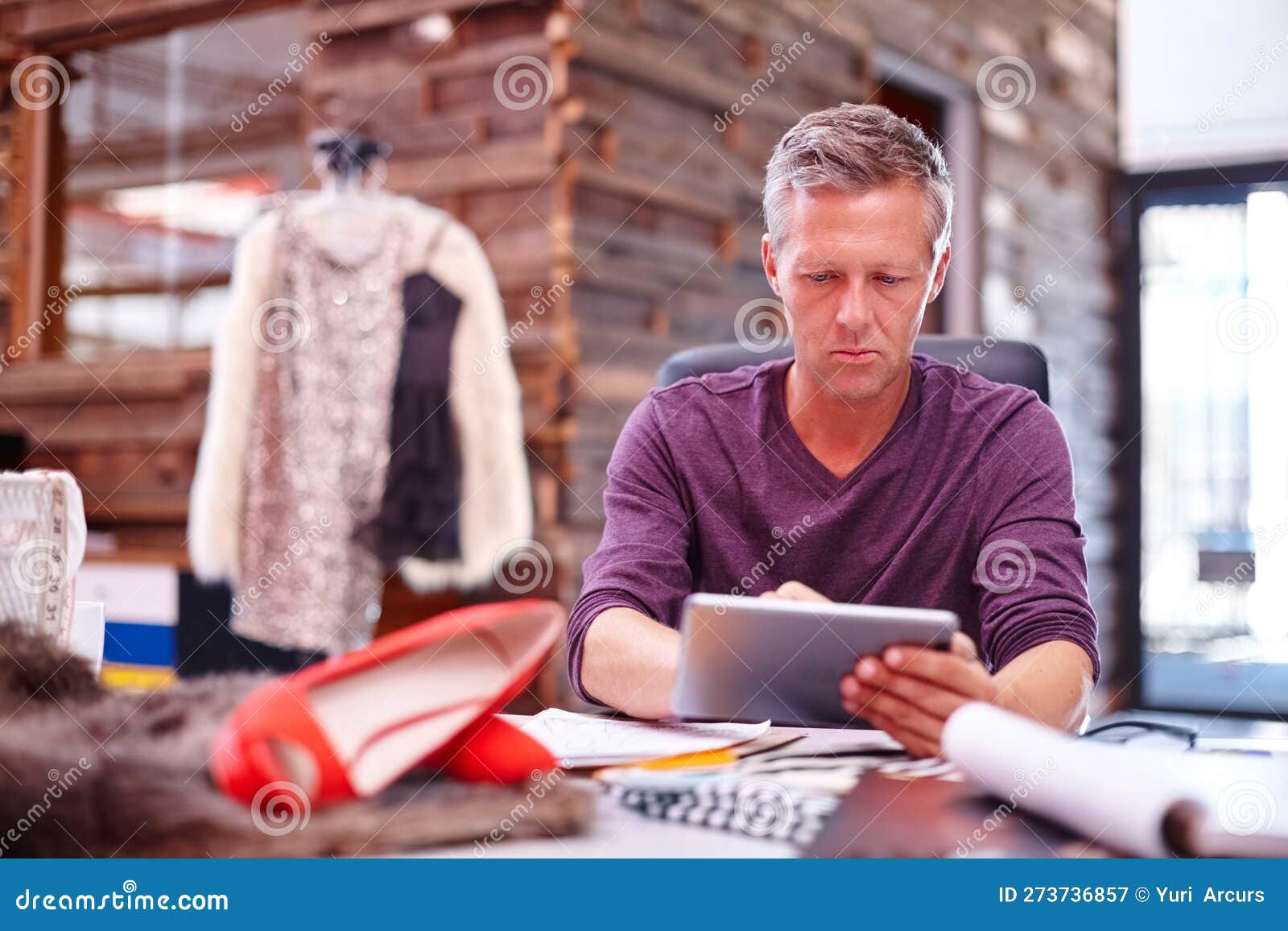 Checking for Materials Online. a Handsome Designer at Work in His ...