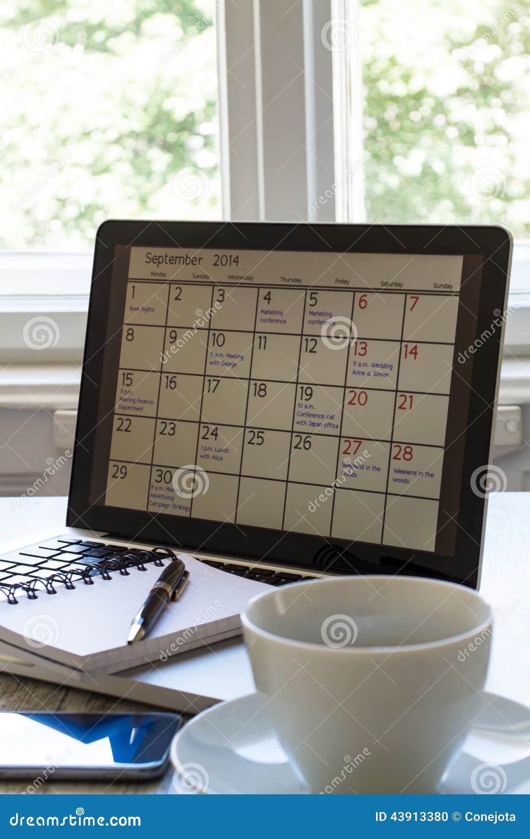 Checking Monthly Activities in the Calendar in the Laptop Stock Photo ...