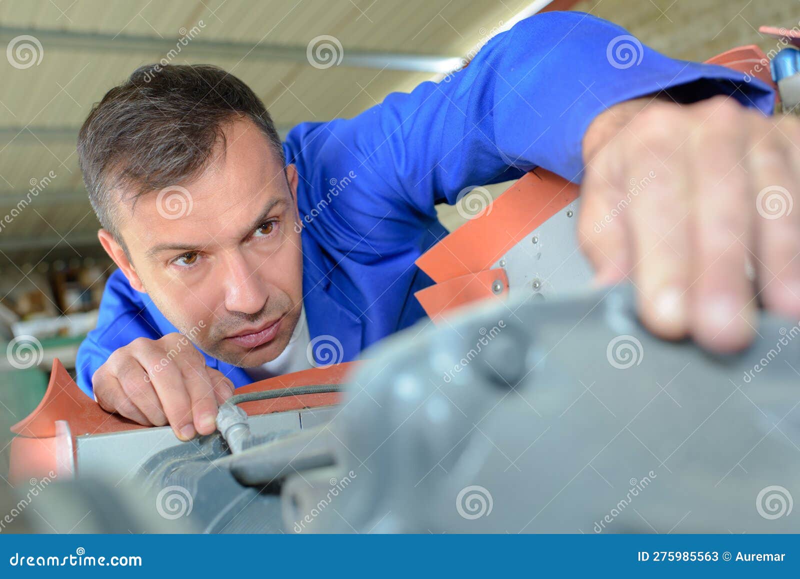 Checking on the motor stock image. Image of middleage - 275985563