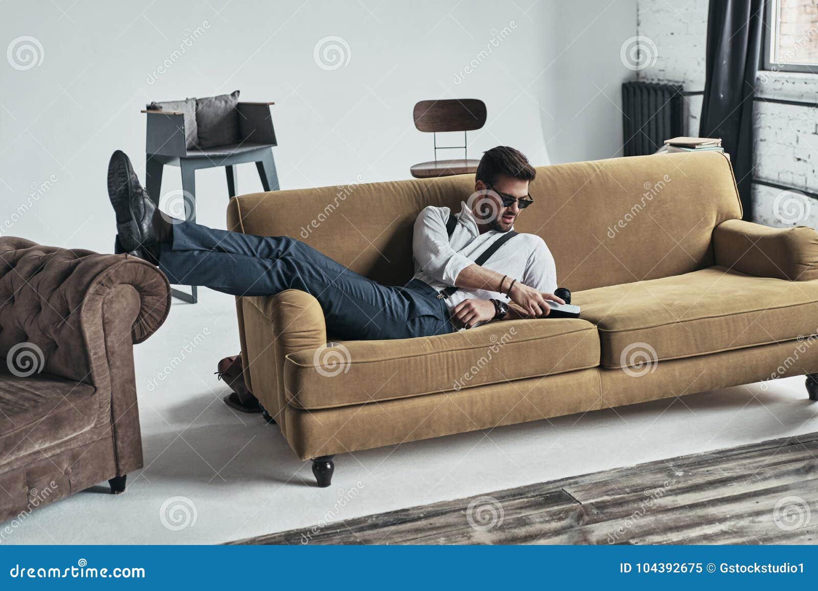 Checking out his camera. stock image. Image of beauty - 104392675