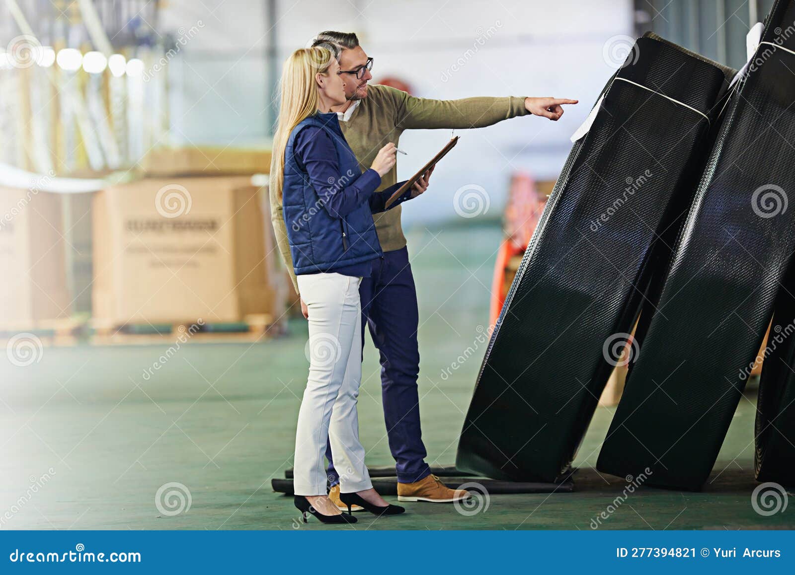 Checking Output Quality. a Two Managers Examining Product while ...