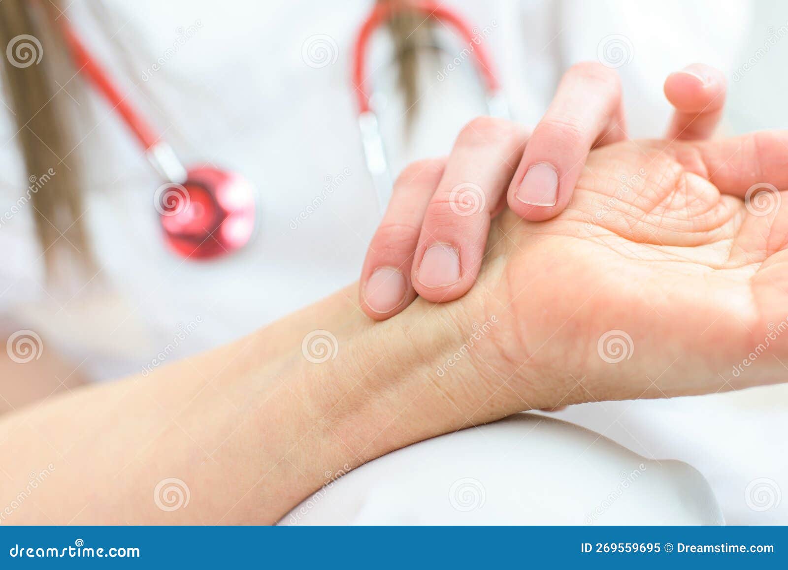 Checking a patient s pulse stock image. Image of hand - 269559695