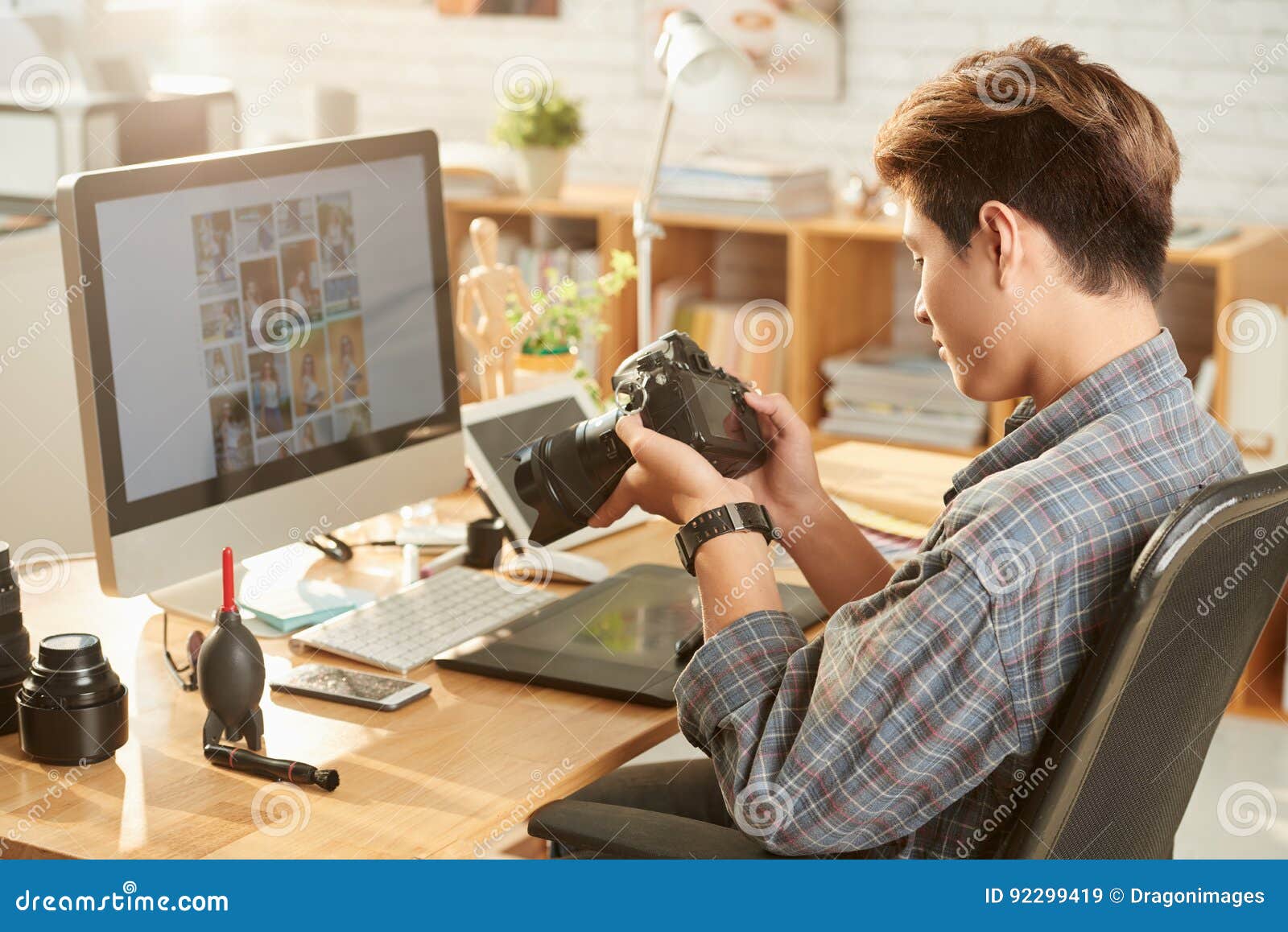 Checking photos stock image. Image of shoot, table, occupation - 92299419