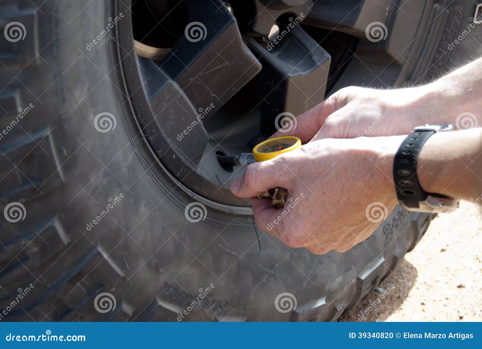 Checking pressure of tyre stock photo. Image of examine - 39340820