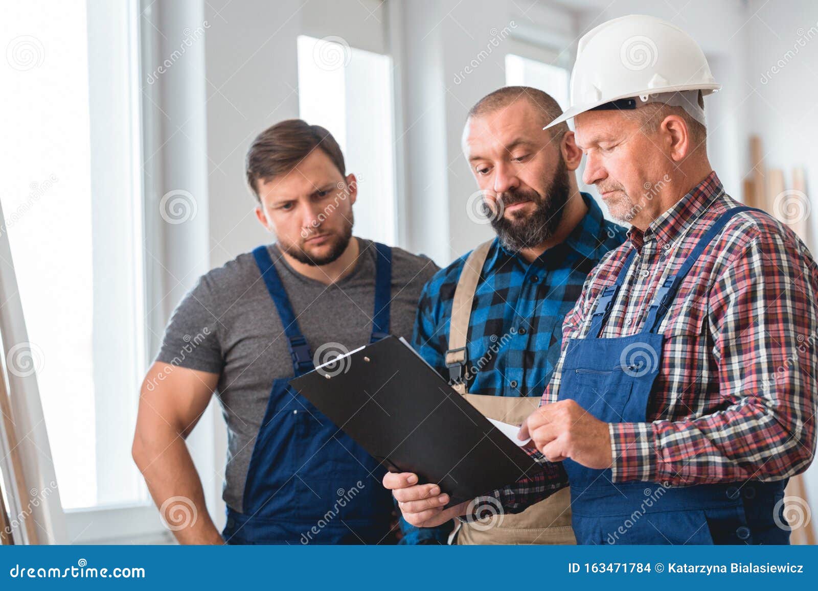 Checking the project stock photo. Image of painter, renovation - 163471784