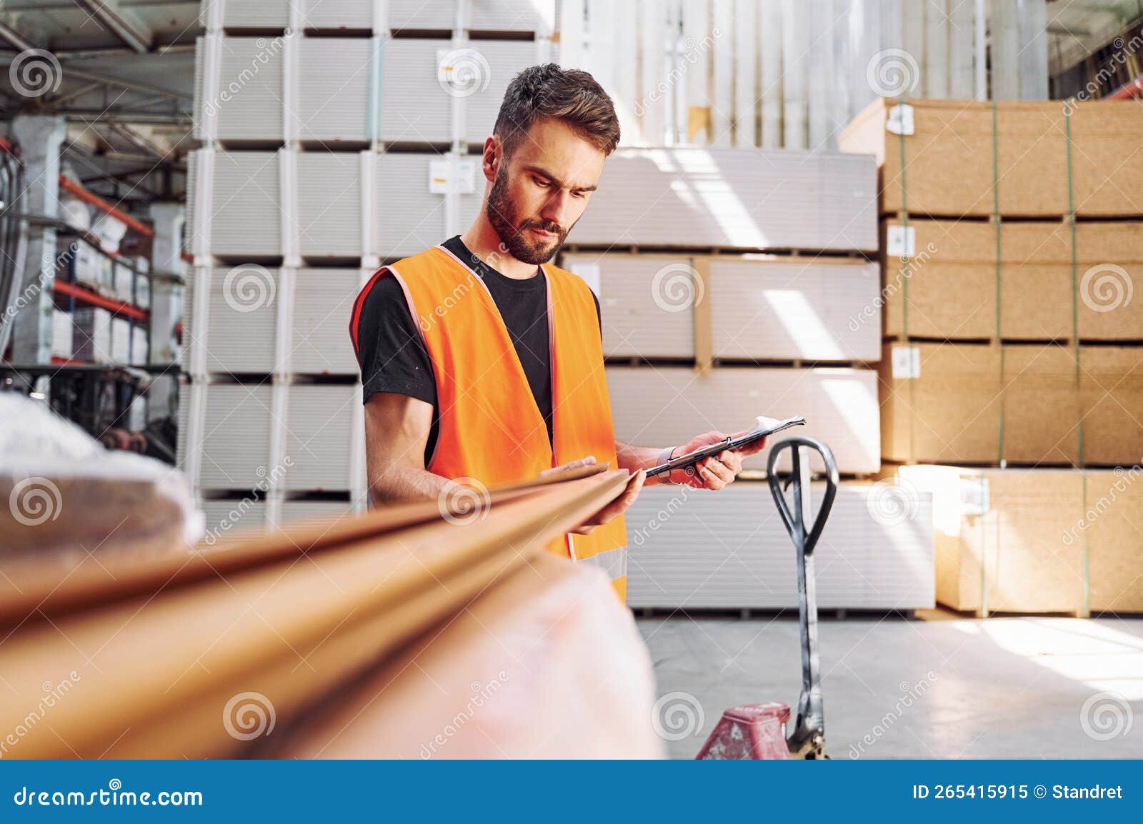 Checking Quality of Product. Storage Worker is in the Warehouse Stock ...