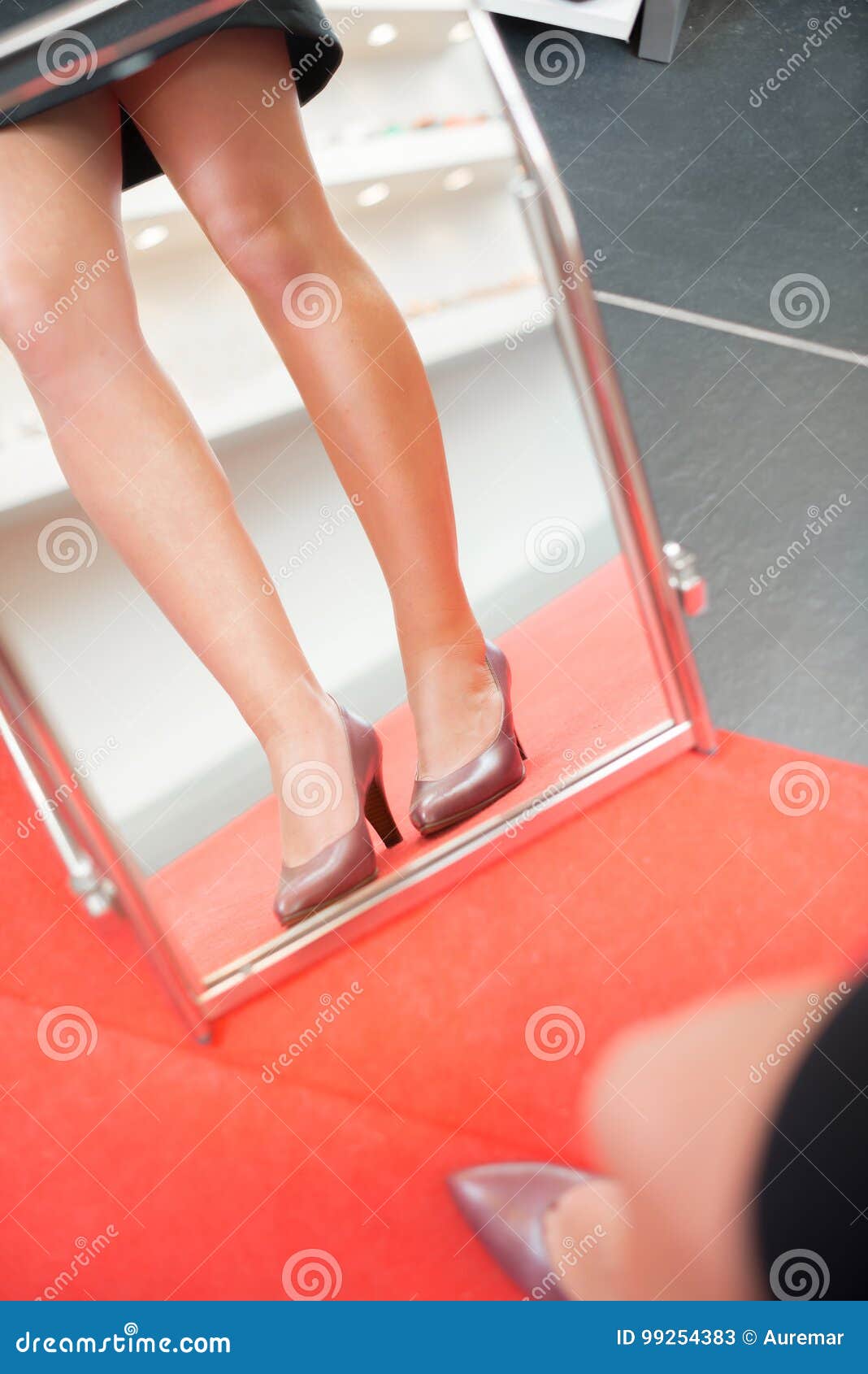 Checking shoes in mirror stock image. Image of adult - 99254383