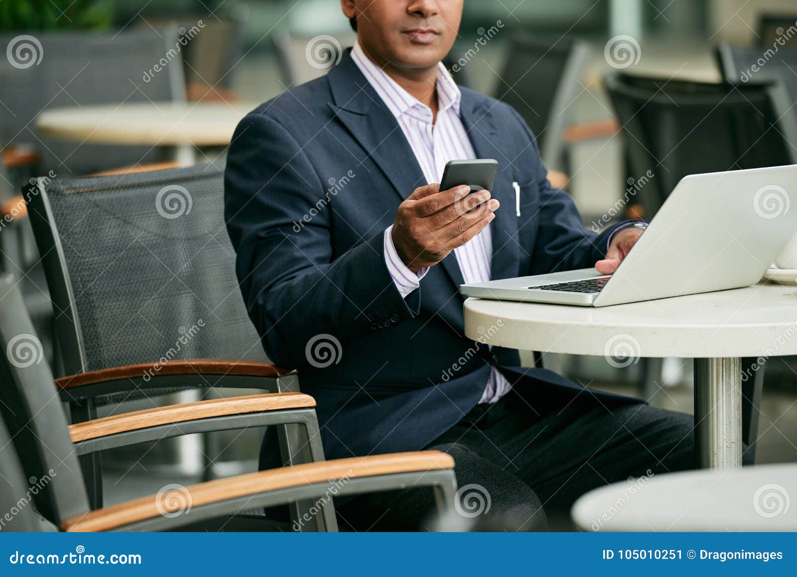 Checking smartphone stock image. Image of businessman - 105010251