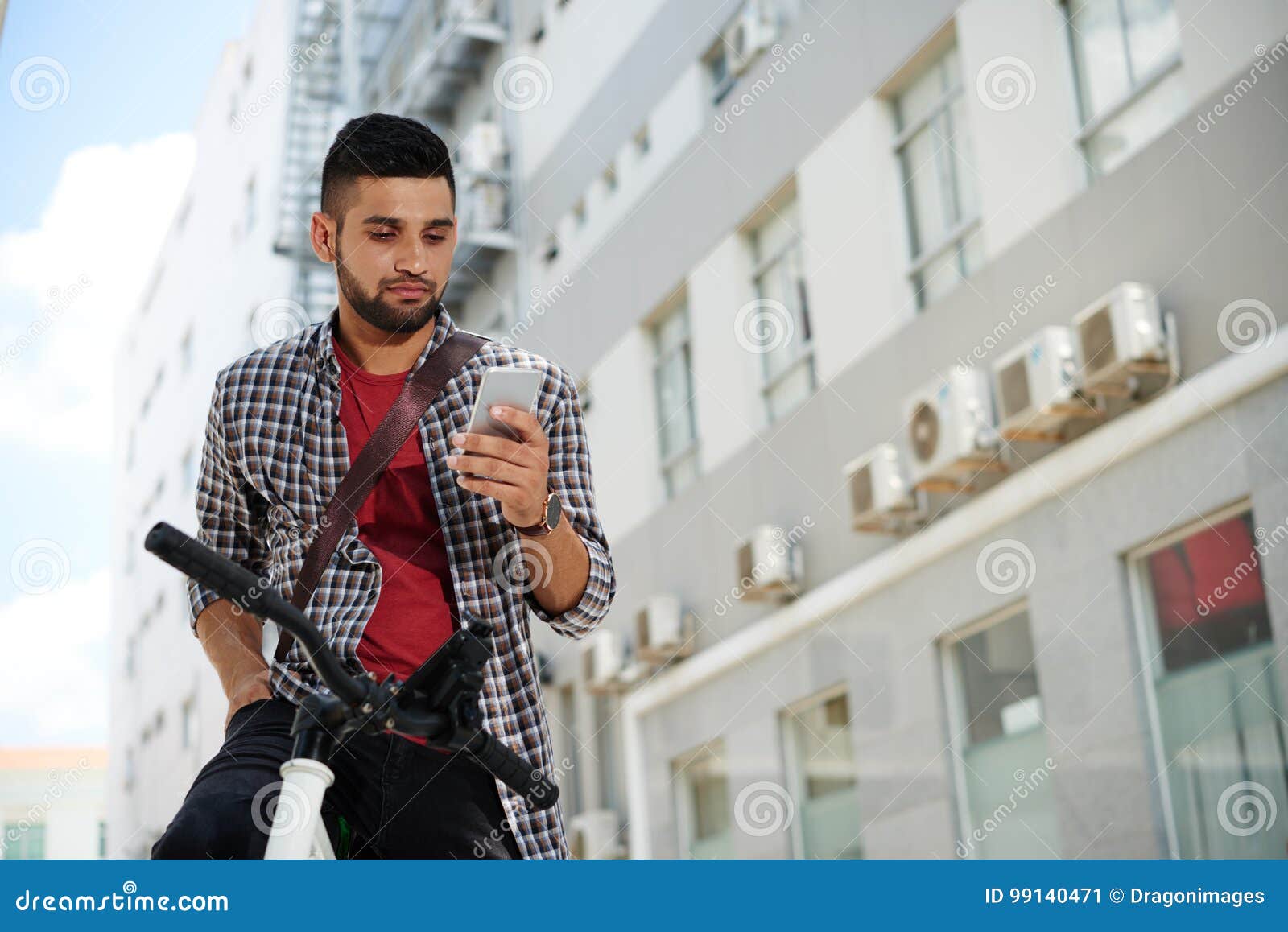 Checking smartphone stock image. Image of handsome, communication ...