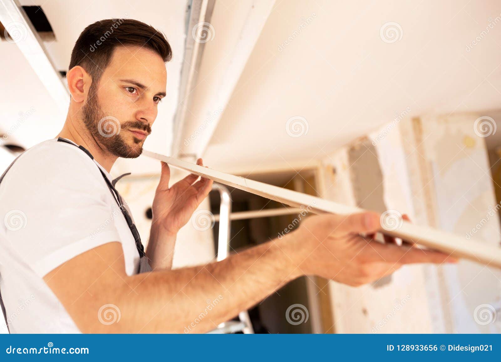 Checking the Surface Smoothness of a Ceiling Element Stock Photo ... Checking the Surface Smoothness of a Ceiling Element Stock Photo ...