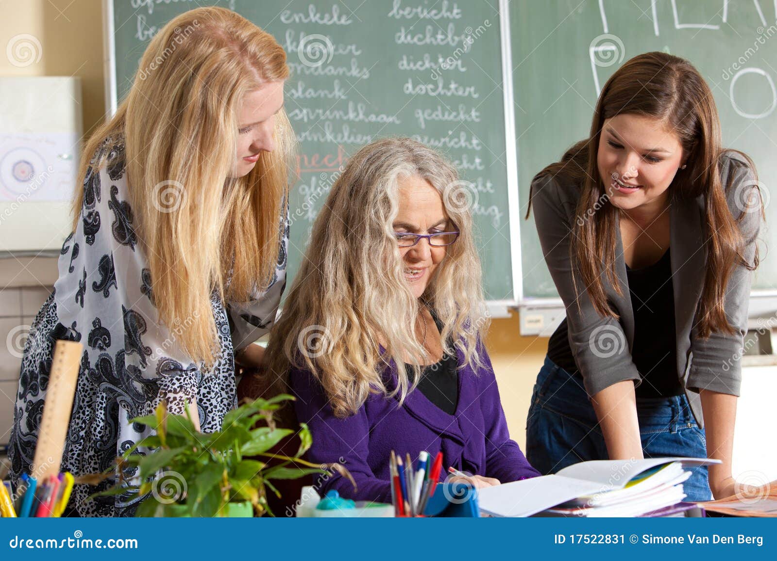 Checking with the teacher stock image. Image of learning - 17522831