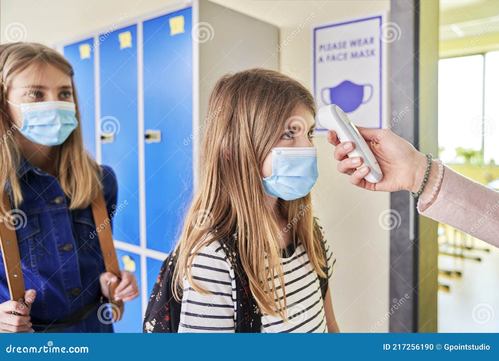 Checking the Temperature of the Students before Entering the Classroom ...