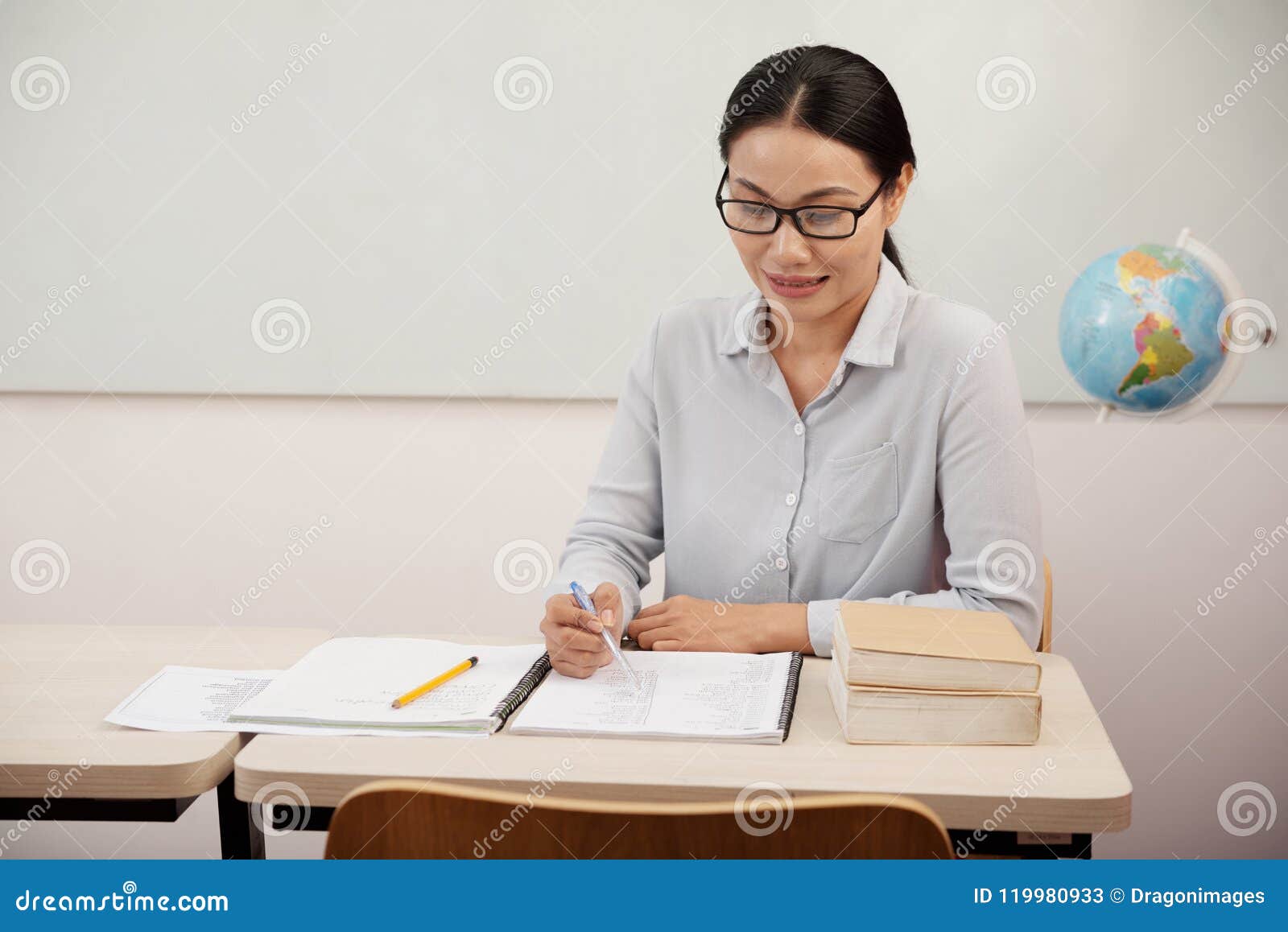 Checking textbook stock image. Image of office, teacher - 119980933