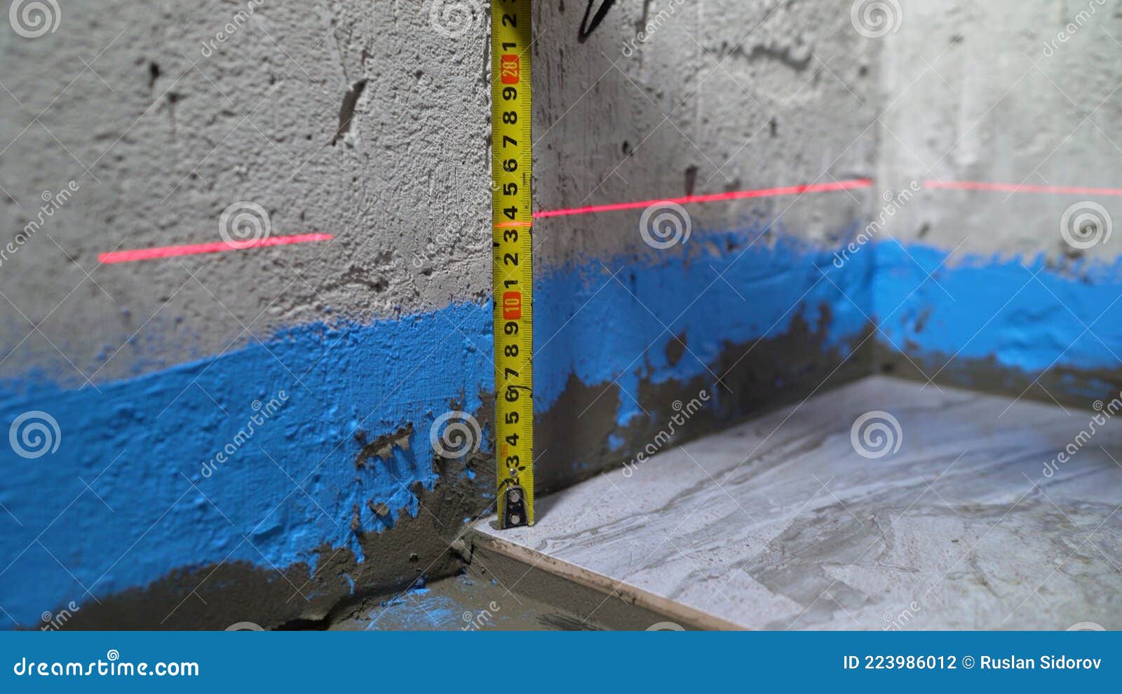 Checking The Tiles In The Bathroom. Quality Control When Laying Ceramic ...