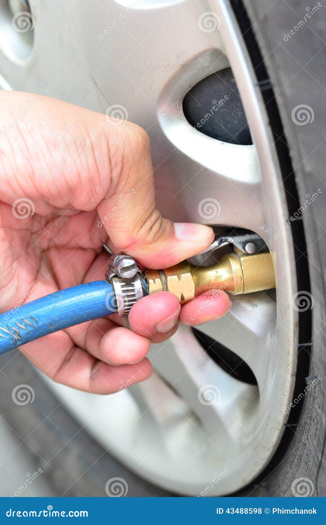 Checking Tire Pressure stock photo. Image of pressure - 43488598