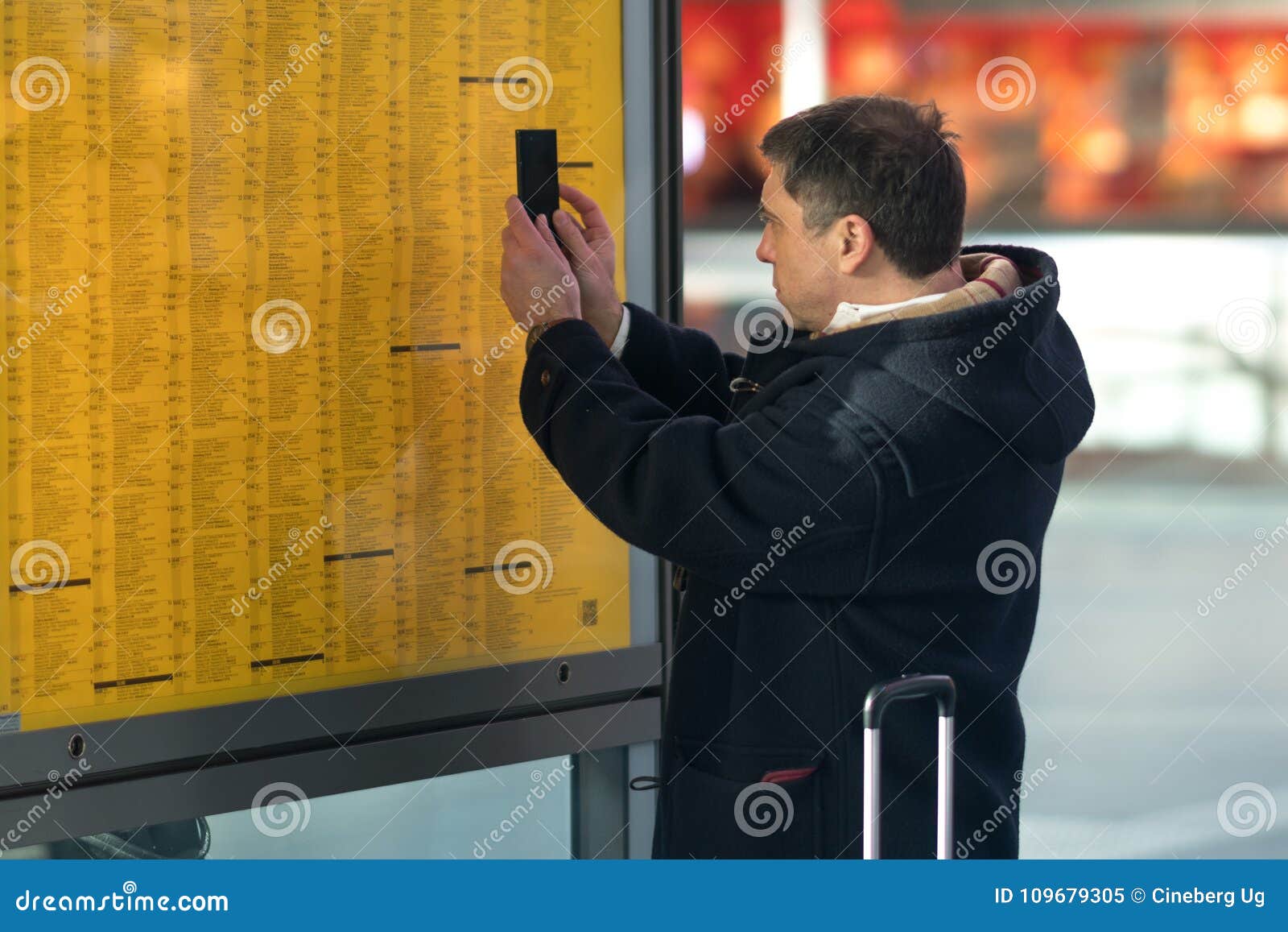 Checking the Train Time Board at Railroad Station Editorial Image ...