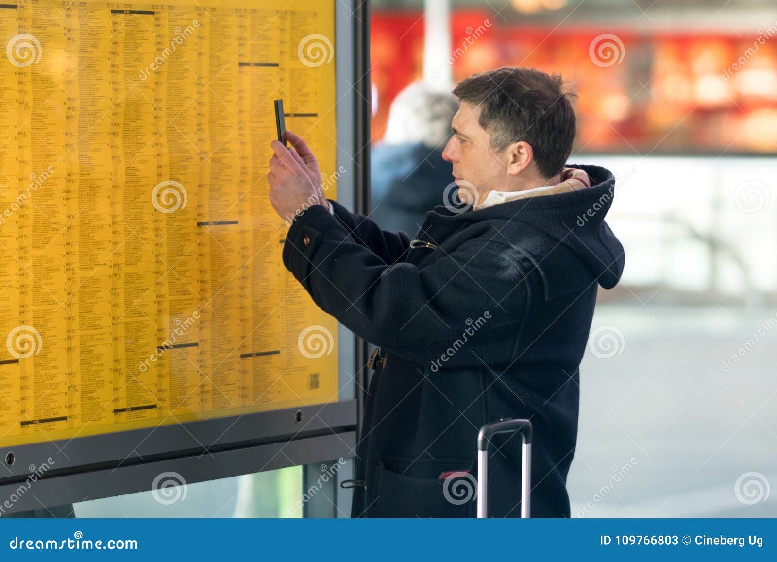 Checking the Train Time Board at Railroad Station Stock Image - Image ...