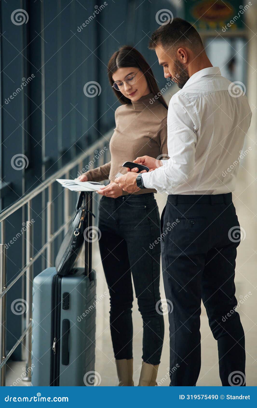 Checking the Valid Information. Woman is with Airport Worker, with ...
