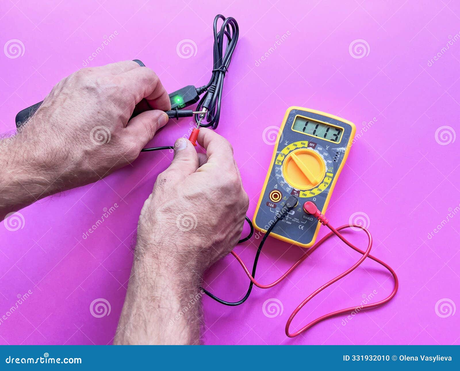 Checking the Voltage of the Adapter with a Multimeter Stock Photo ...