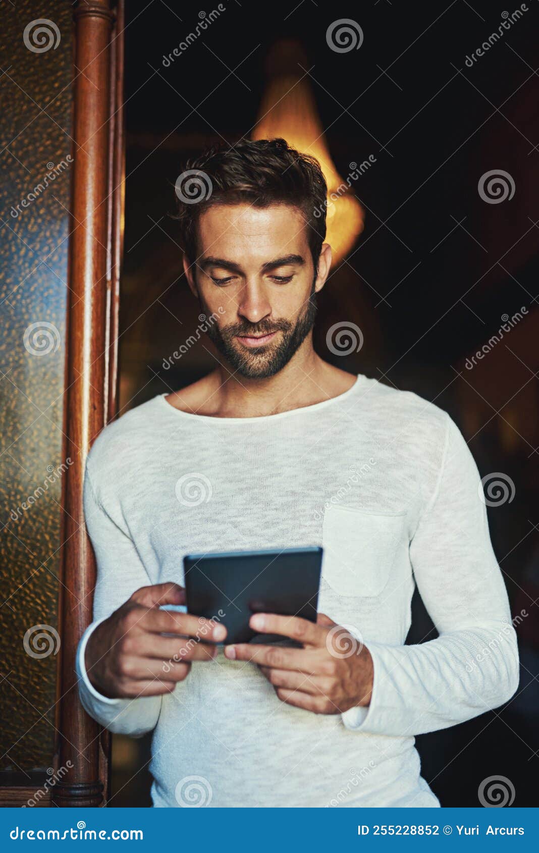 Checking In With The World Wide Web A Handsome Man Using A Digital