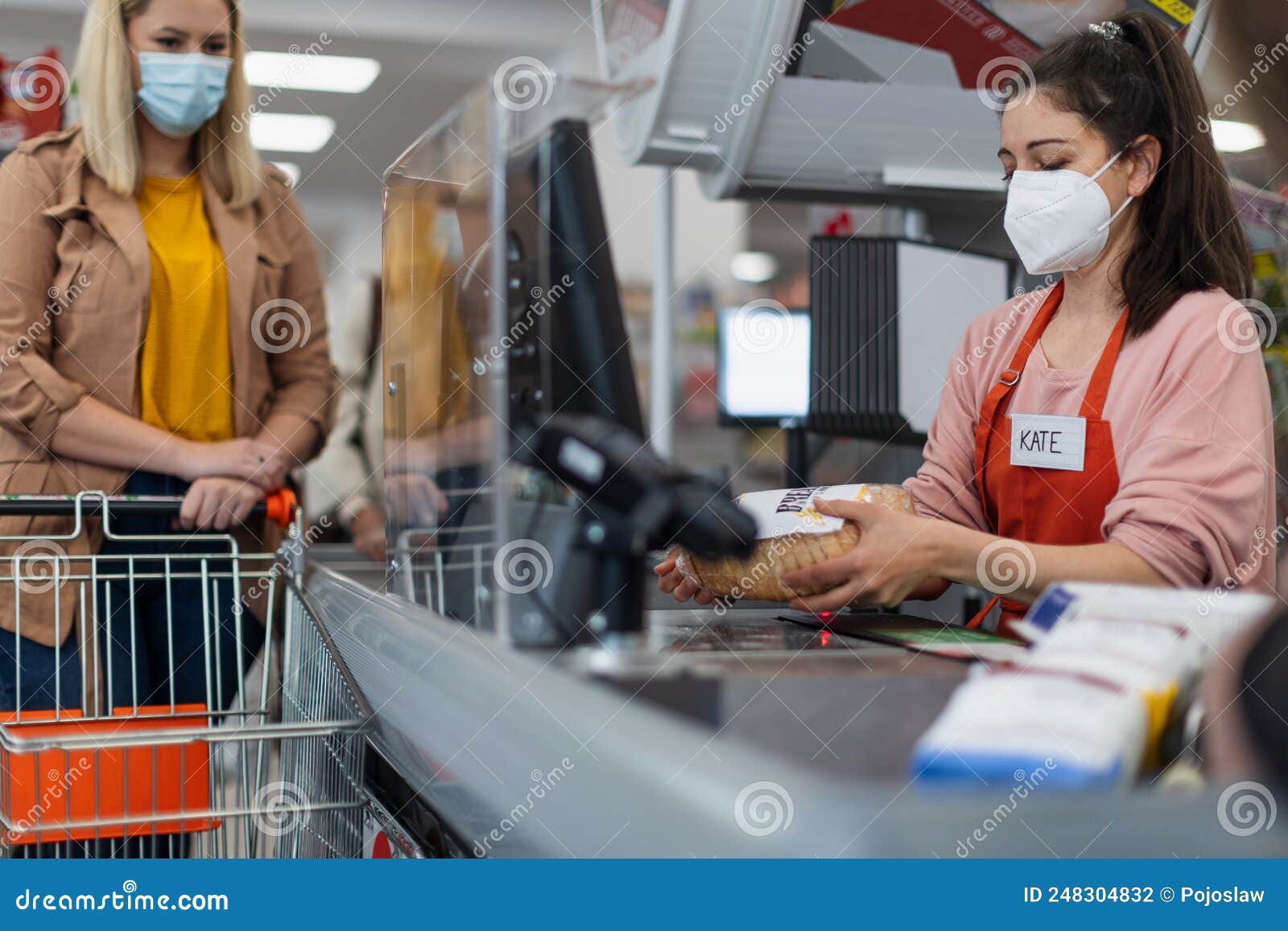 A Checkout Counter Cashier Scans Bread in Supermarket. Stock Photo ...