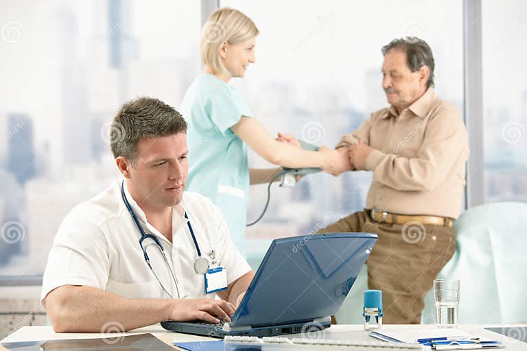Checkup in doctor s office stock image. Image of group - 21446425