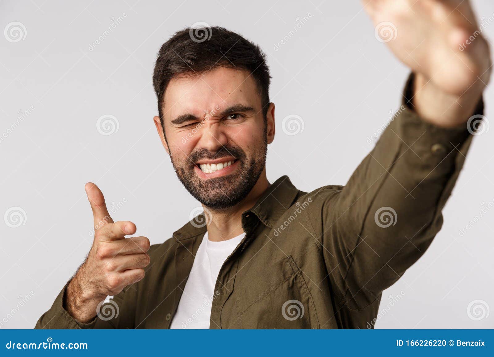 Cheeky And Carefree Confident Handsome Bearded Guy Taking Selfie As