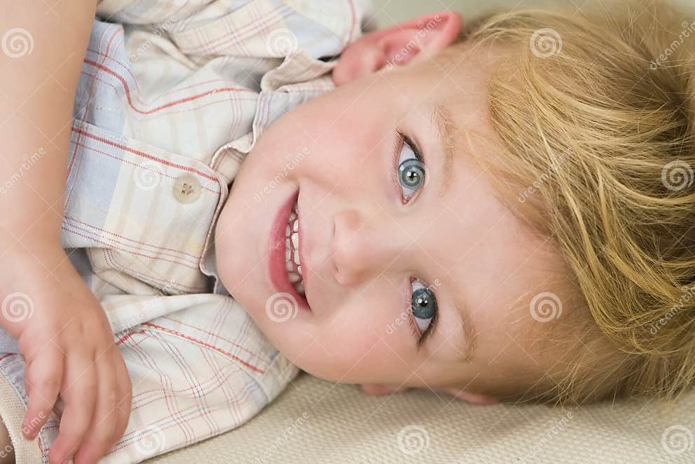Cheeky Grin stock photo. Image of child, sweet, grin, blue - 6716990