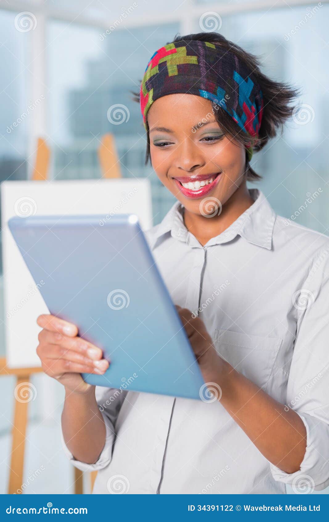 Cheerful Artist Using Tablet Stock Photo - Image of hairband ...