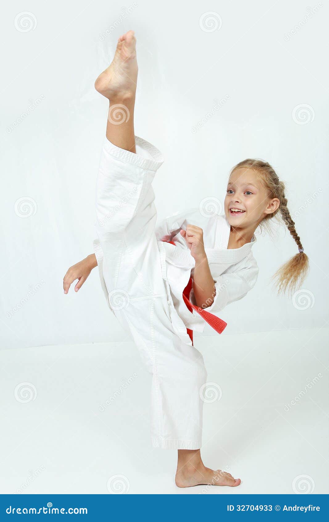 Cheerful Athlete in a Kimono Performs a High Kick Leg Circular Stock ...