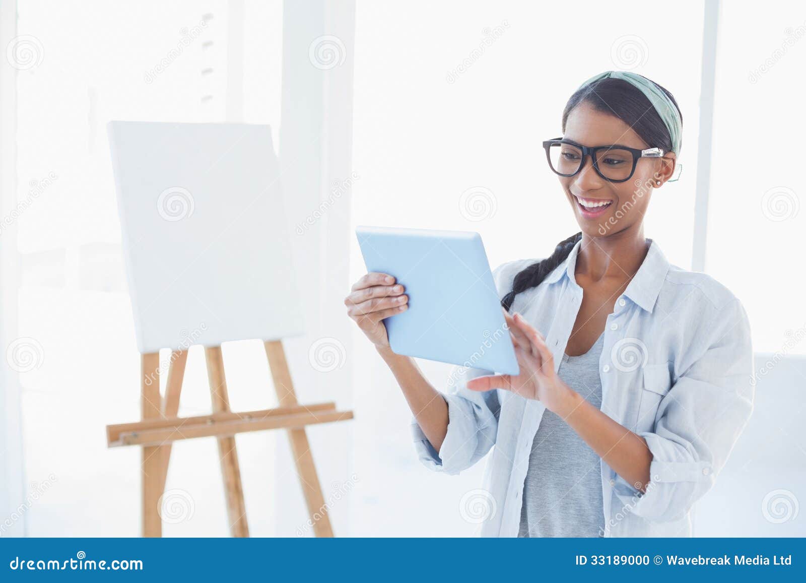 Cheerful Attractive Artist Using Her Tablet Pc Stock Photo - Image of ...