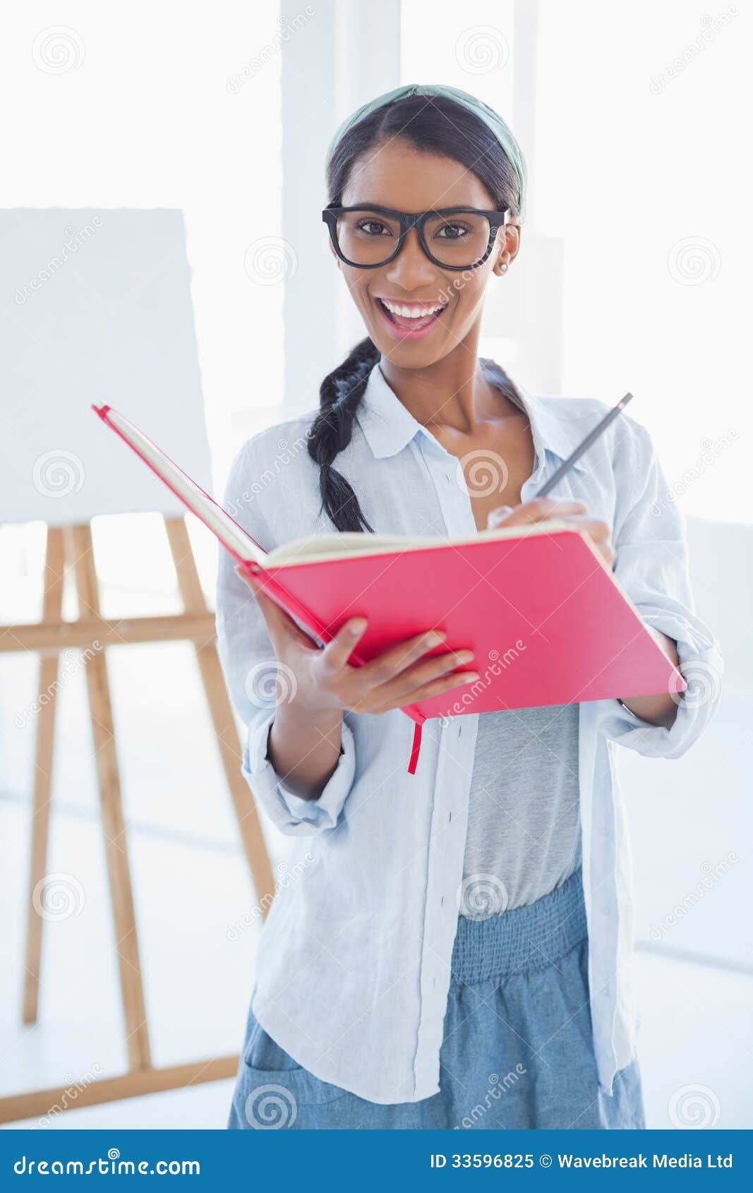 Cheerful Attractive Artist Writing on Her Notebook Stock Image - Image ...