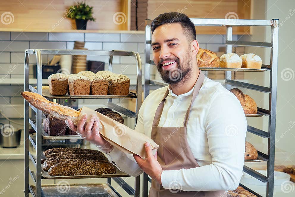Cheerful Baker Delivering Bread To Client in Store Stock Photo - Image ...