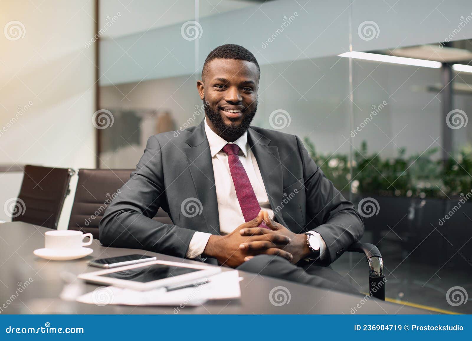 Cheerful Black Guy CEO Sitting at Conference Hall Stock Image - Image ...